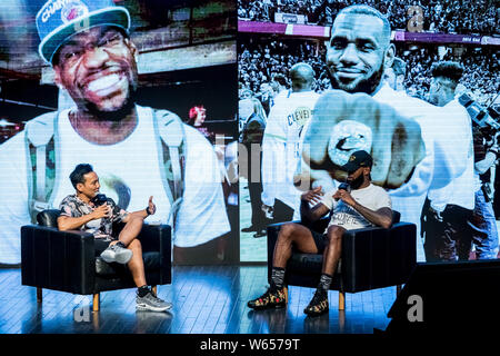 NBA star LeBron James, right, of Los Angeles Lakers attends the POWER ...