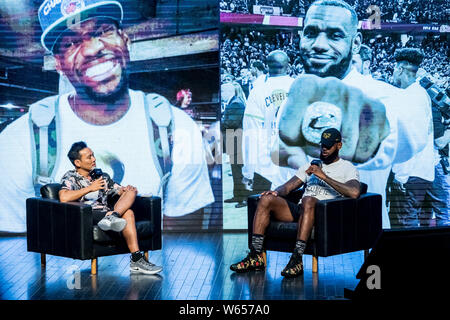 NBA star LeBron James, right, of Los Angeles Lakers attends the POWER ...