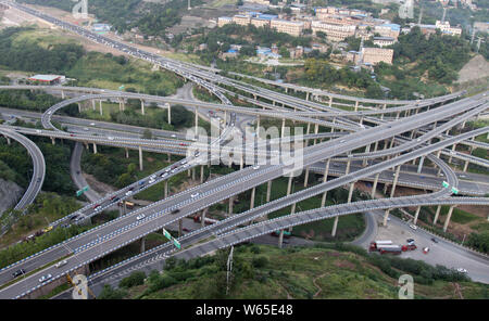 Cars drive on the five-level Huangjuewan Overpass, the world's "most ...