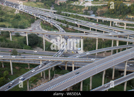 Cars drive on the five-level Huangjuewan Overpass, the world's "most ...
