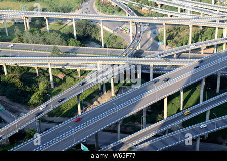 Cars drive on the five-level Huangjuewan Overpass, the world's "most ...