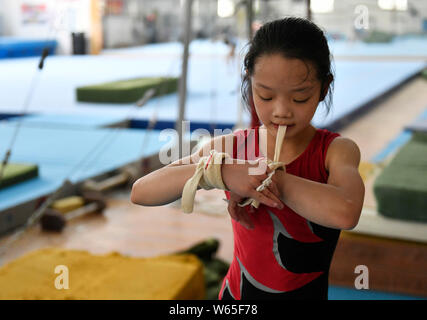 A boy takes part in the gymnastic training at the Nanchang Gymnastic ...