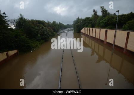 Flooding which has closed the A555 in Stockport, Manchester Stock Photo ...