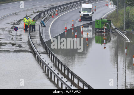 Flooding which has closed the A555 in Stockport, Manchester Stock Photo ...