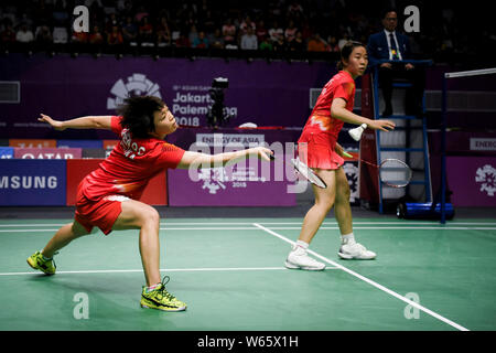 Jia Yifan, left, of China returns a shot as she and Chen Qingchen compete against Misaki ...