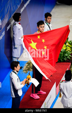 Gold medalist China, center, waves as silver medalist Japan, left, and ...