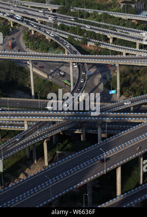 Cars drive on the five-level Huangjuewan Overpass, the world's "most ...