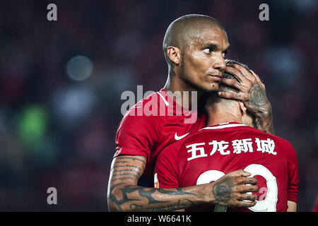 Brazilian football player Fernando Karanga, top, of Henan Jianye heads ...