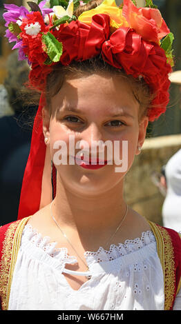 Photo of pretty sweet girl dressed knit pullover holding hashtag empty ...