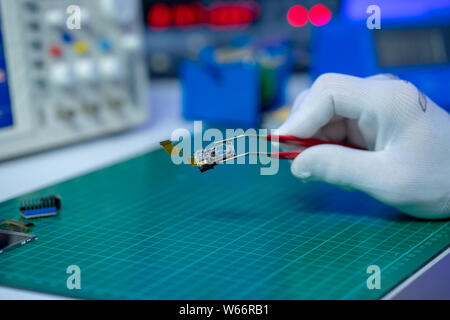 in a electrical engineering laboratory at a research institution or ...