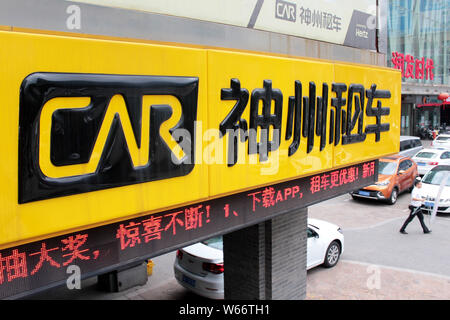 --FILE--A signboard of Chinese car rental company eHi Car Service, also ...