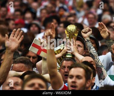 Fans cheer before the World Cup Group J soccer match between Austria ...