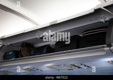 interior detail of a Boeing 737 aeroplane. Seat numbers, air ...