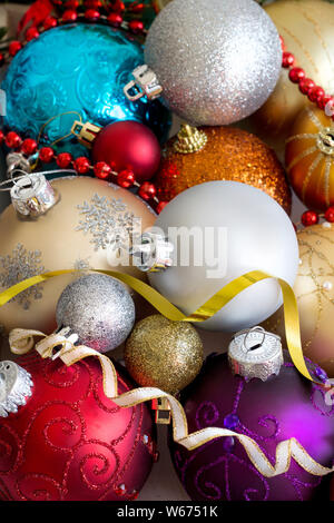 Colorful christmas baubles in wooden boxes repeating on white ...