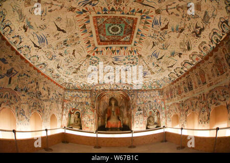 View of the replica of frescoes in the No. 285 grotto of the Mogao ...