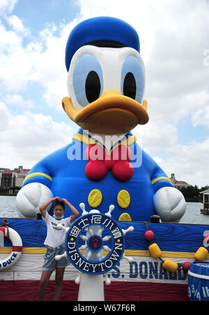 An 11-meter-tall inflatable Donald Duck is on display at the lakeside ...