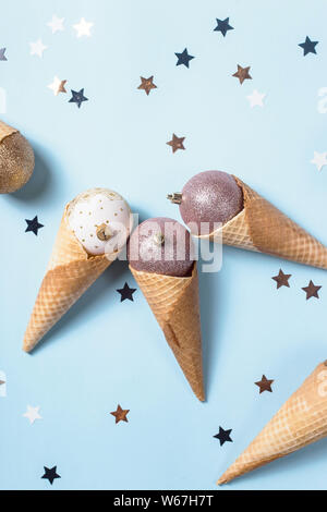 Blue Christmas toy ball among New Year's tinsel. Abstract background or ...