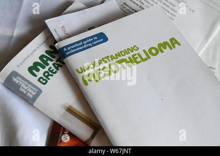 Pictured are leaflets by Macmillan Cancer Support about Mesothelioma ...