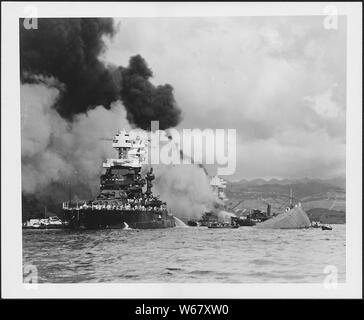 Photograph of the Capsized USS Oklahoma and the USS Maryland after the ...