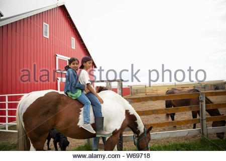 Two boys riding a horse bareback at Appleby Horse Fair in Cumbria Stock ...