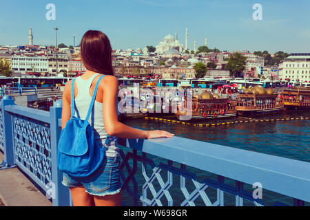 Young tourist woman on Galata bridge, Golden Horn bay, Istanbul ...