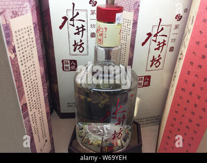 --FILE--Bottles of Chinese baijiu maker Jiang Xiao Bai are for sale in a supermarket in Shanghai ...