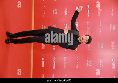 Taiwanese actor Zhang Zhen poses as he arrives on the red carpet for ...