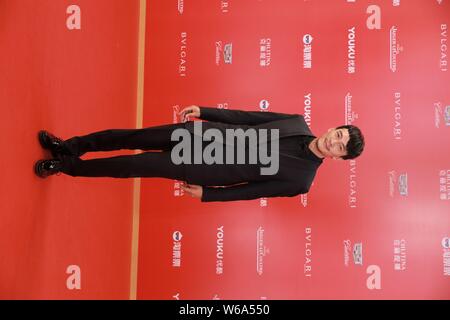 Taiwanese actor Zhang Zhen poses as he arrives on the red carpet for ...