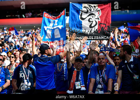 Fans wave French flags during the World Cup Group I soccer match ...