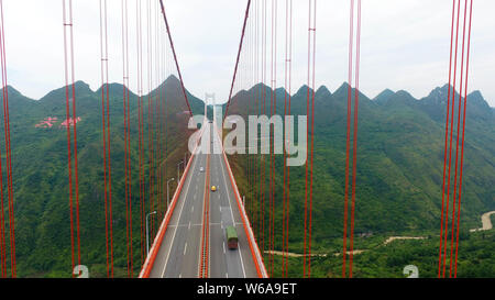 Aerial view of the Baling River Bridge 370 meters high over a valley in ...