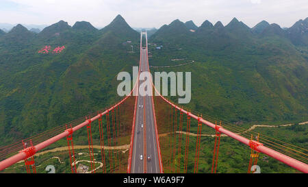 Aerial view of the Baling River Bridge 370 meters high over a valley in ...