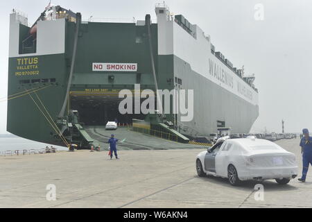 Cars to be shipped are been driven onto the TITUS Pure Car Truck ...