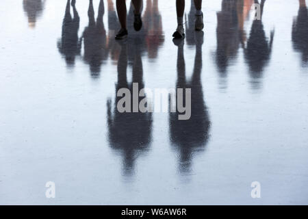 Black shadow of a group people on the ground Stock Photo - Alamy