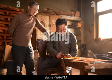 --FILE--Pipa, a four-stringed Chinese musical instrument, and Ruan, a ...