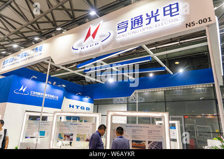 --FILE--People visit the stand of Jiangsu Hengtong Optic-Electric Co ...