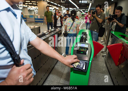 A turnstile to have the QR code on a mobile app scanned to pay for ...