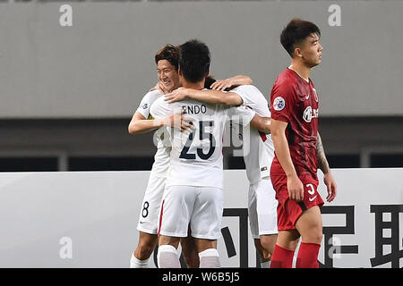 Japan's players celebrate their second goal against Saudi Arabia during ...