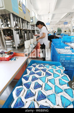 A Chinese worker manufactures footballs for the 2018 FIFA World Cup at ...
