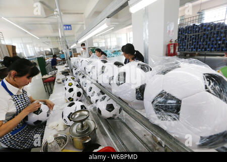Chinese workers manufacture footballs for the 2018 FIFA World Cup at ...