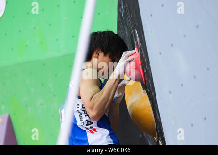 Kai Harada of Japan competes in the men bouldering qualification match ...