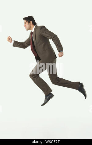 Business man running away Stock Photo - Alamy