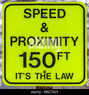 Square Speed and Proximity road sign against a snow covered mountain in ...