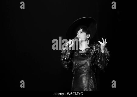 Chinese singer Li Yunchun performs during her concert in Shanghai ...