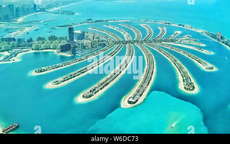 An aerial view of the Palm Jumeirah artificial island which resembles a ...