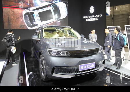 People visit a new energy vehicle exhibition in a shopping mall in ...