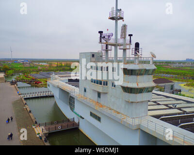 An aerial view of a building that resembles an "aircraft carrier ...