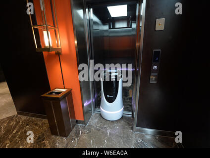 An intelligent robot serves customers at a high tech hotel in Chengdu ...