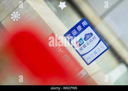 --FILE--View of logos of China UnionPay, left, and Quickpass at a ...