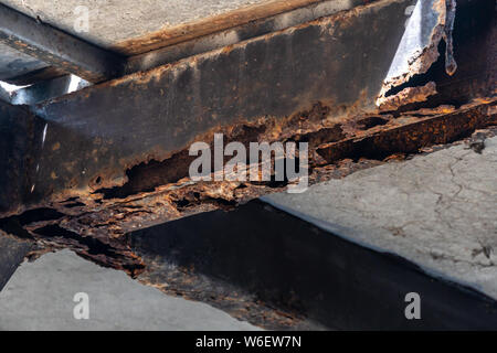 Rust on steel structural columns & post floor support Stock Photo - Alamy