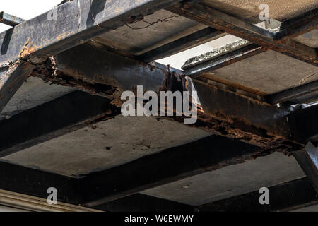 Rust on steel structural columns & post floor support Stock Photo - Alamy